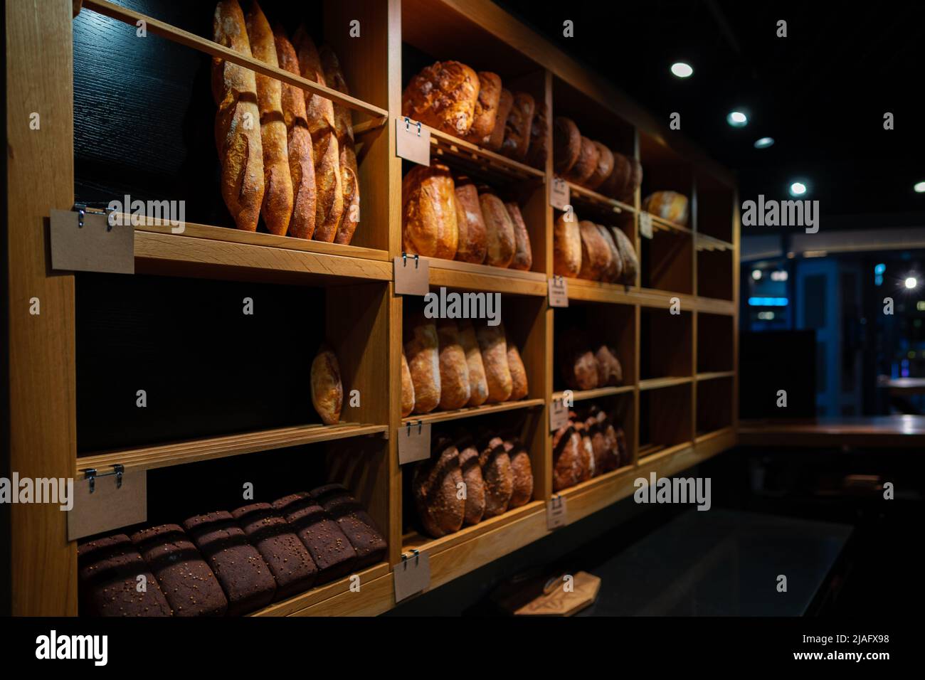 Bread to sell on counter in bakery shop Stock Photo - Alamy
