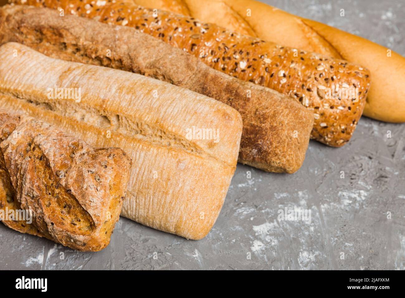 Homemade natural breads. Different kinds of fresh bread as background ...