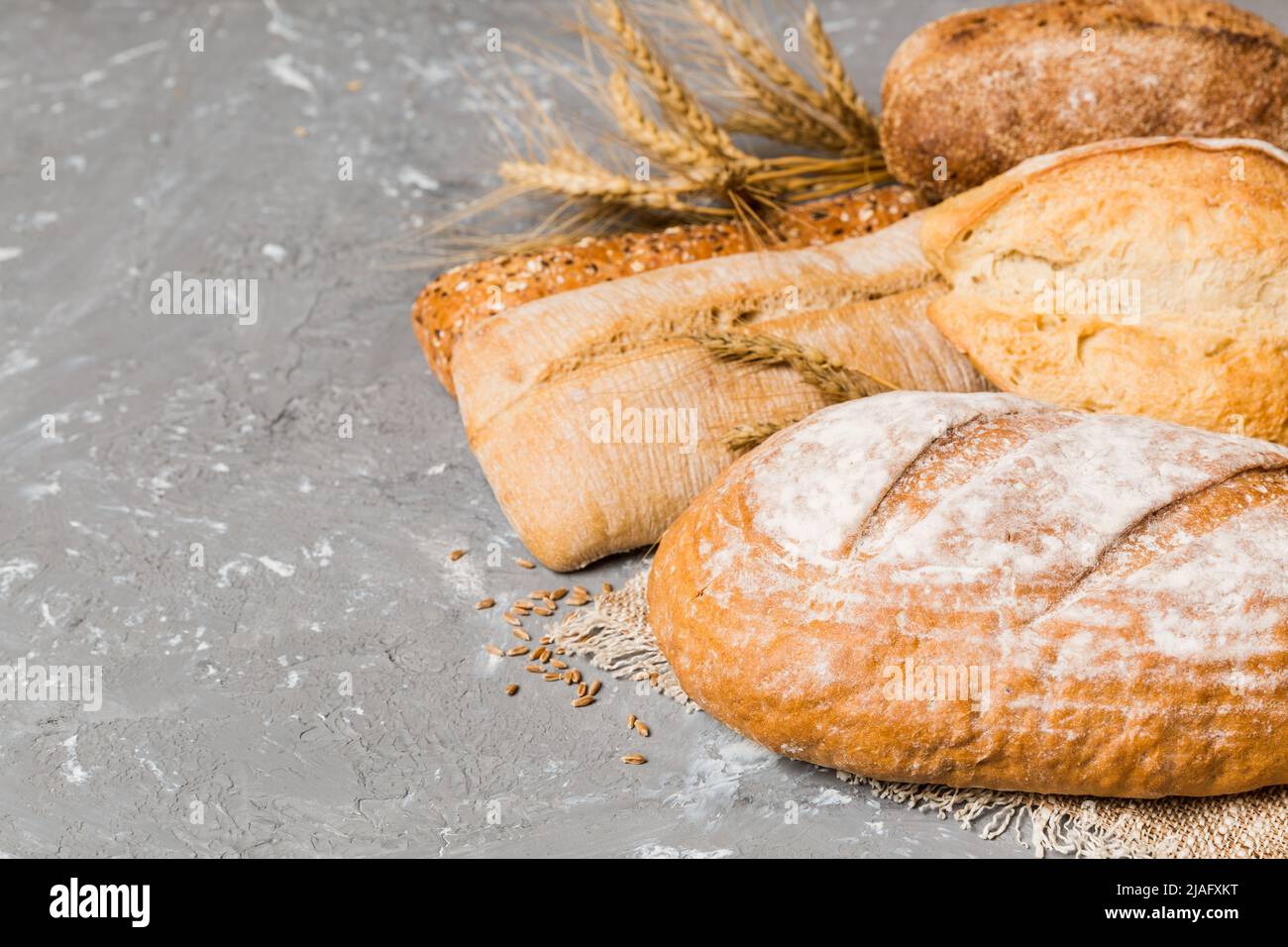 Homemade natural breads. Different kinds of fresh bread as background ...