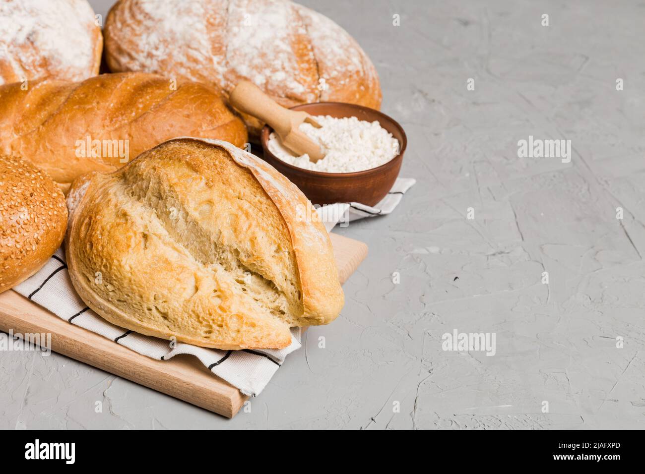Homemade natural breads. Different kinds of fresh bread as background ...