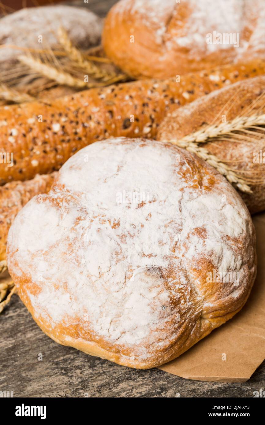 Homemade natural breads. Different kinds of fresh bread as background ...