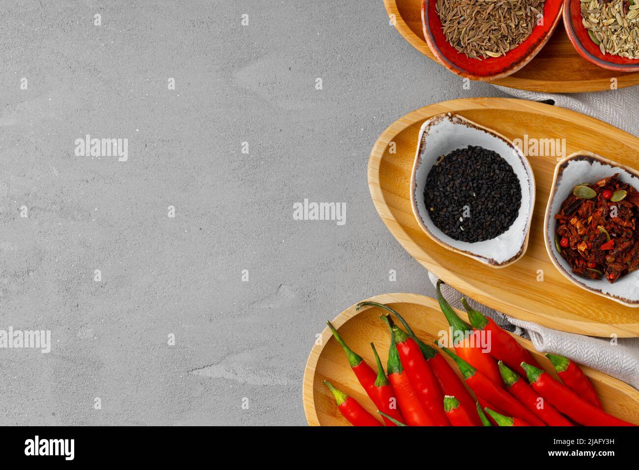 Flat lay composition with chili peppers and spices Stock Photo - Alamy