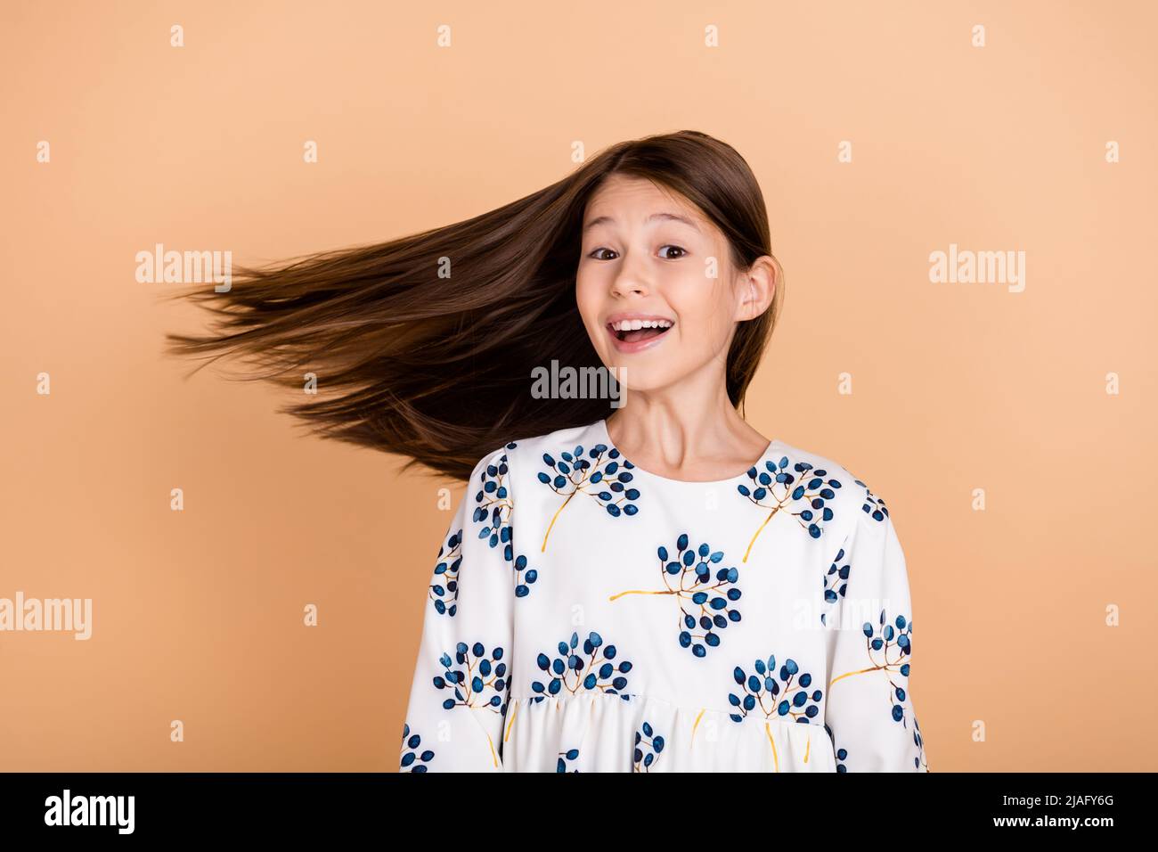 Portrait of attractive cheerful girl throwing hair having fun good mood ...