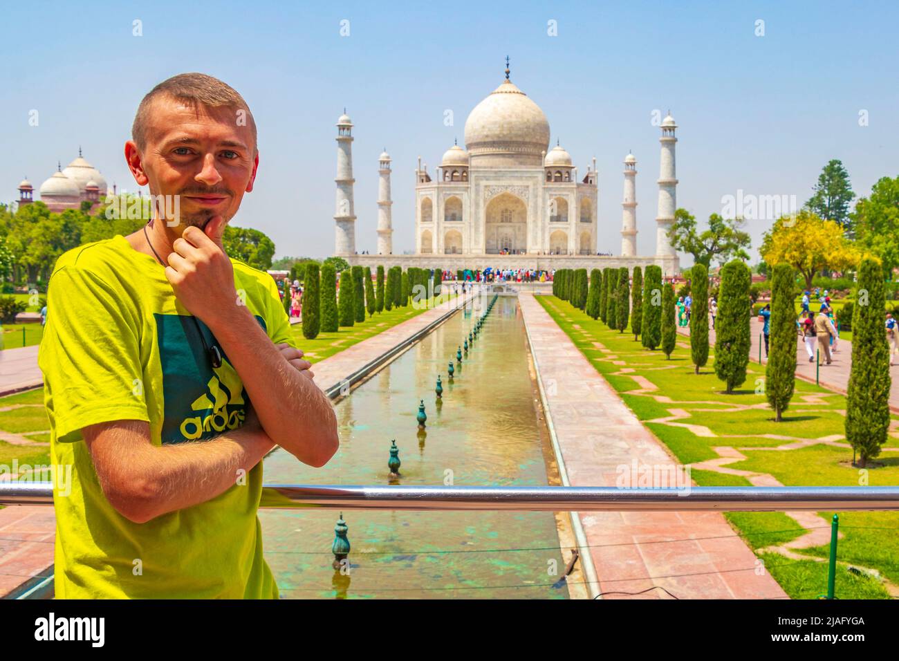 Traveler and tourist poses in front of the famous Taj Mahal in Agra ...
