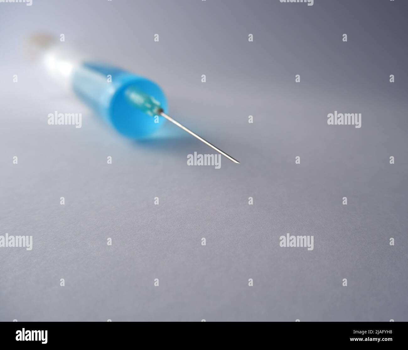 Medical syringe with a needle close-up. Syringe filled with liquid ...