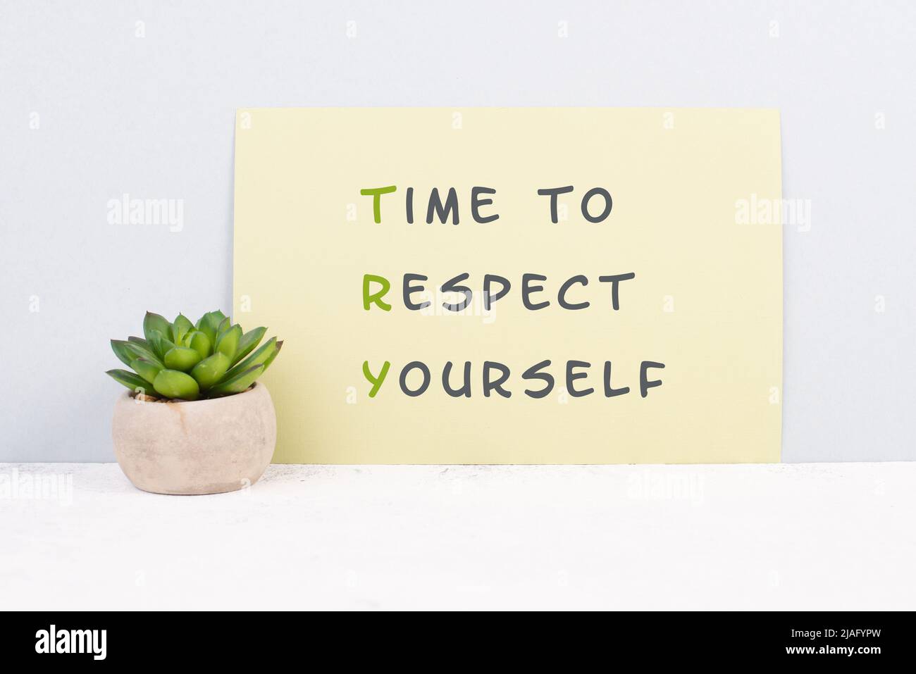 The words time to respect yourself are standing on paper ...