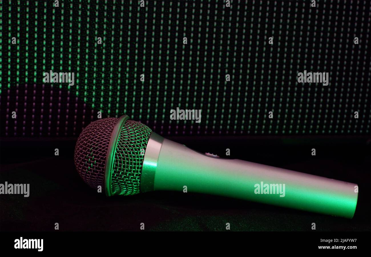 Microphone lying near the audio system in the dark Stock Photo - Alamy
