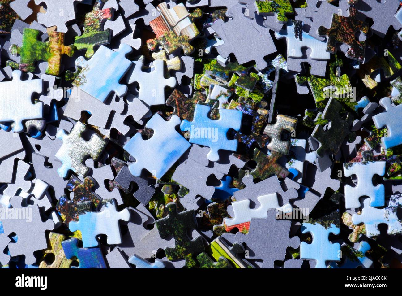 Abstract background of scattered puzzle pieces Stock Photo - Alamy