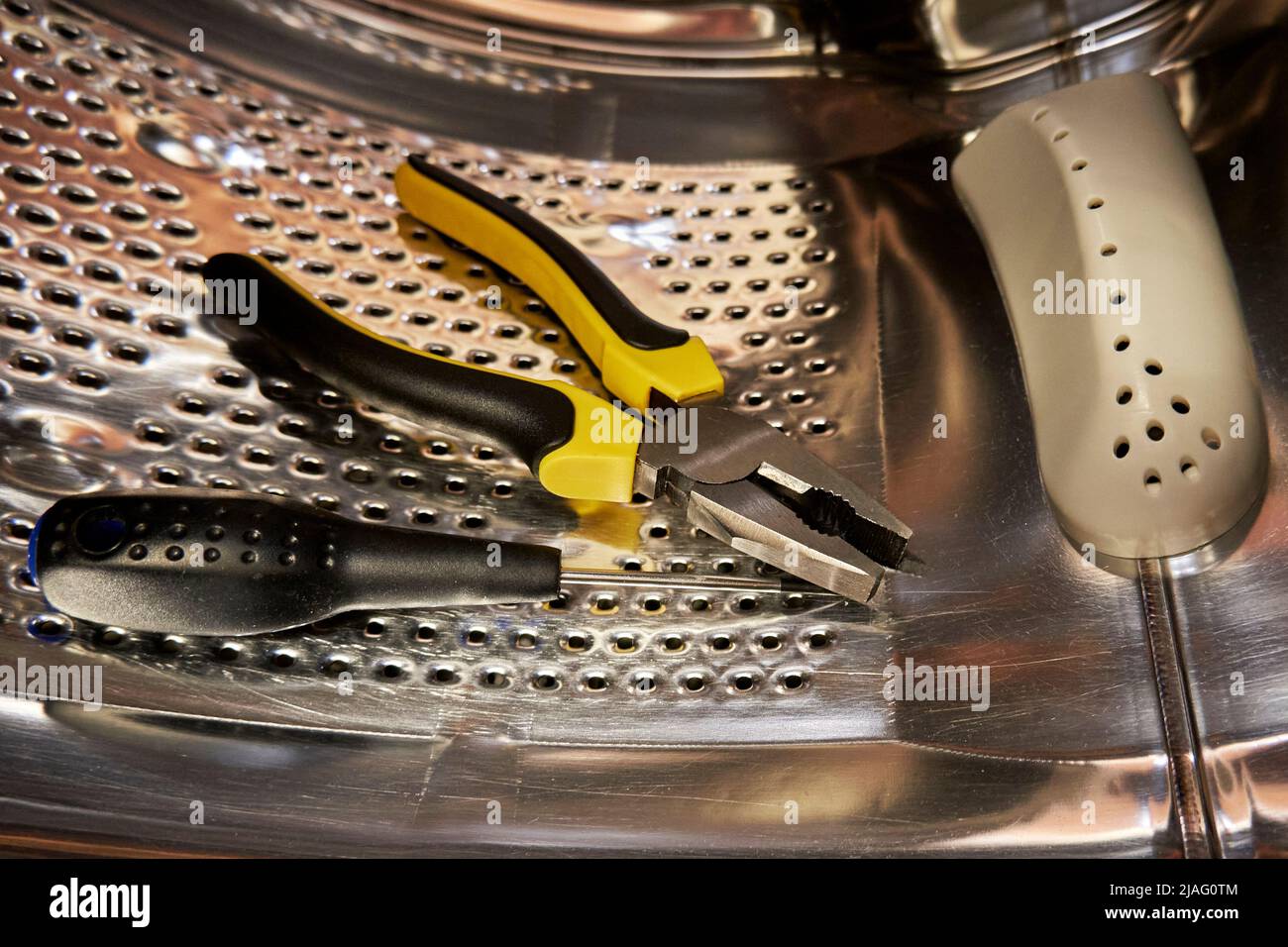 Tools in the drum of the washing machine. Repair of washing machines ...