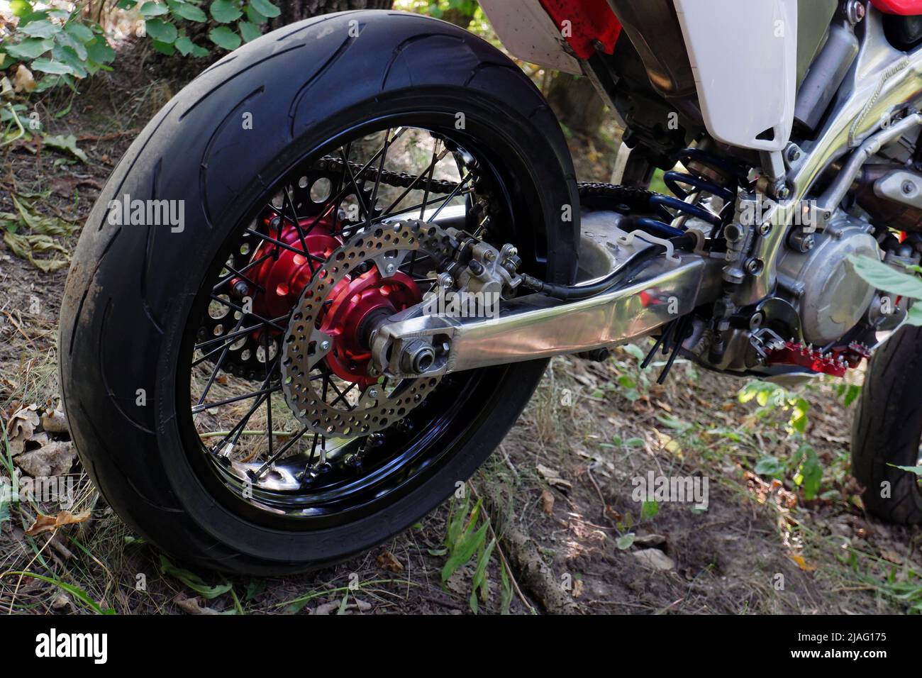 Rear wheel of a sports motorcycle close up. Chrome parts Stock Photo ...