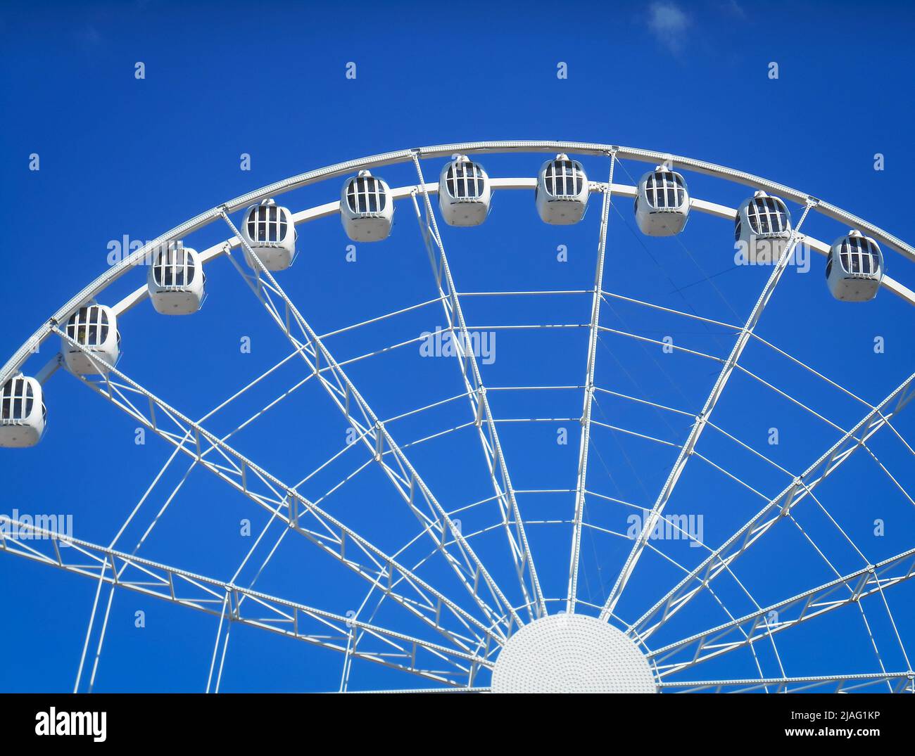 Background with blue sky and part of a ferris wheel, horizontal format ...