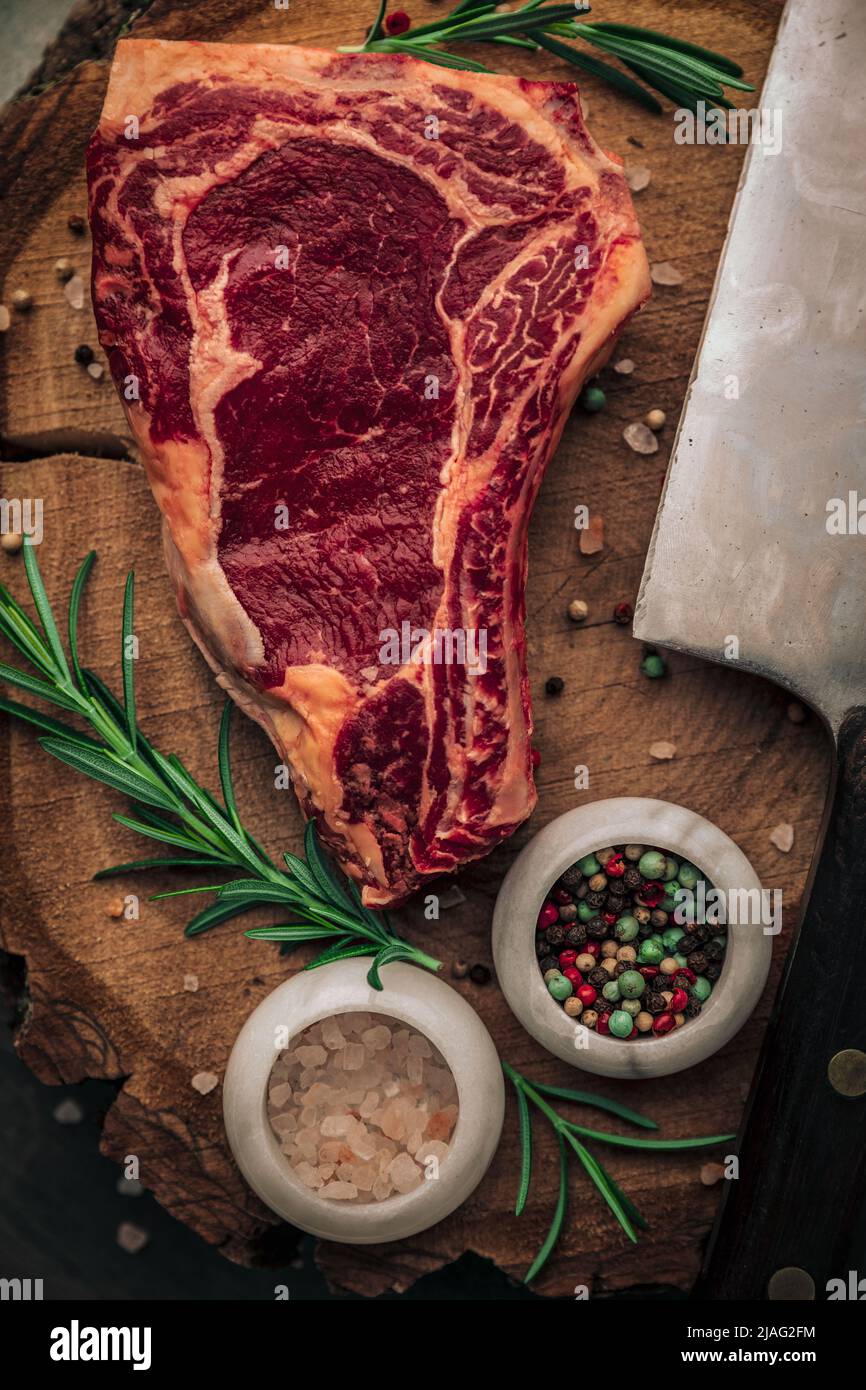 old vintage chopping board with red bloody meat, little bowls of ...