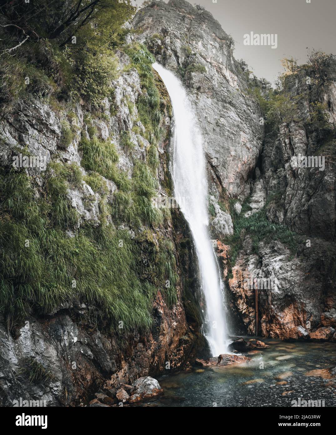 Grunas waterfall 2 km behind the village of Theth in Albania. Theth is ...