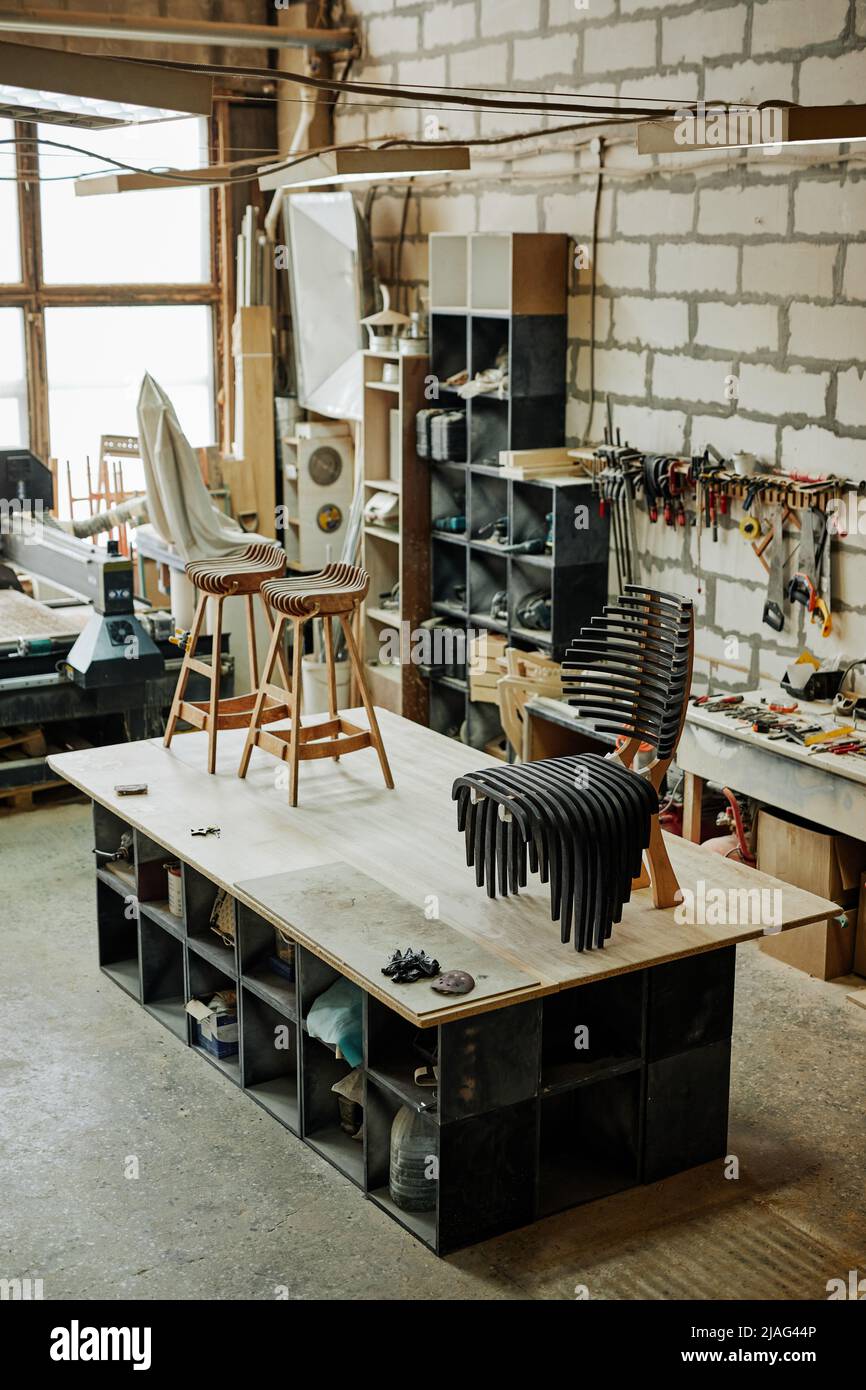 Vertical background image of artisan carpentry workshop in warm tones ...