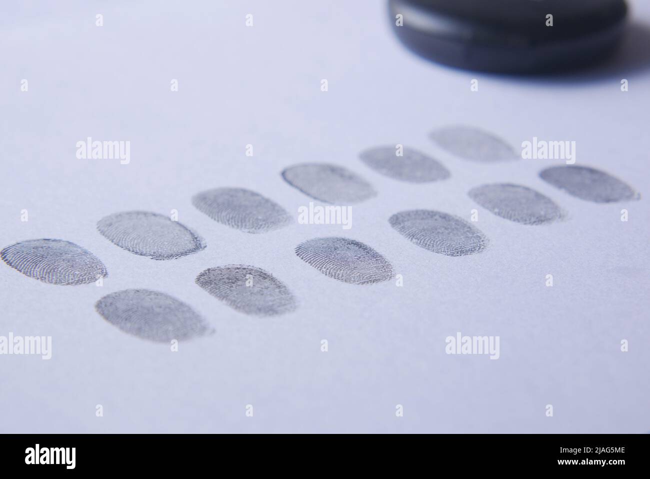 different black fingerprints on a paper close up Stock Photo - Alamy