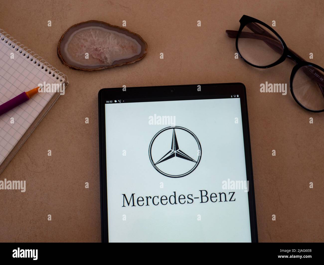 In this photo illustration, a Mercedes-Benz Group AG logo seen ...