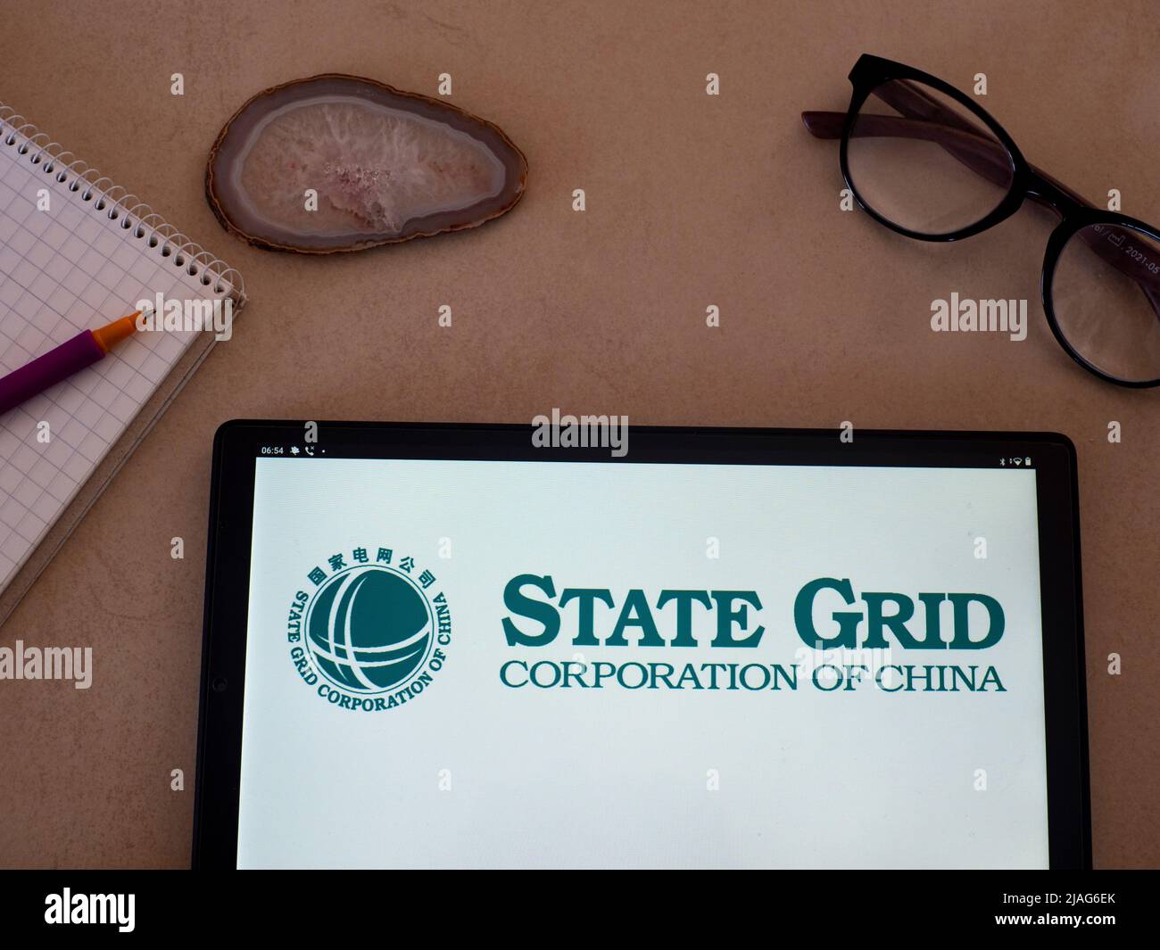 In this photo illustration, a State Grid Corporation of China logo seen ...