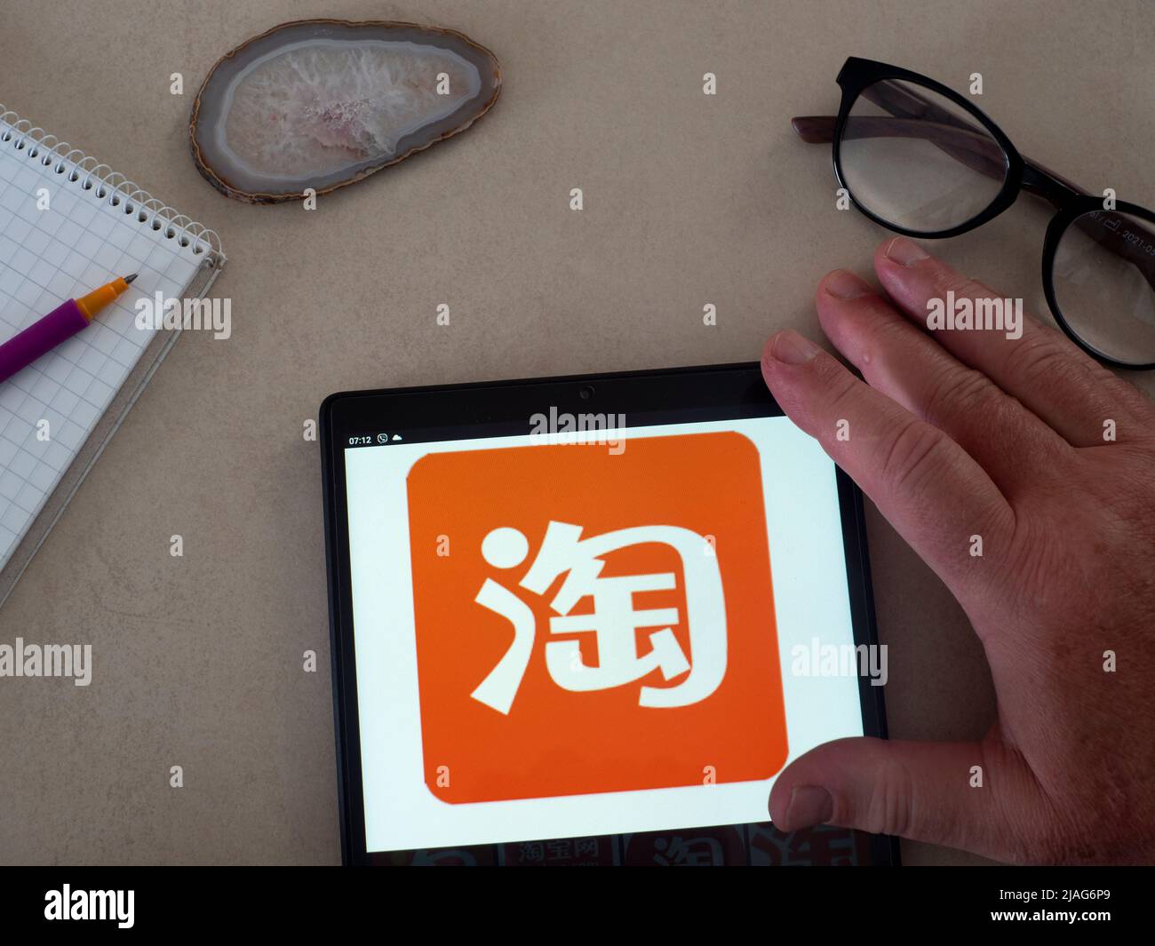 In this photo illustration, a Taobao.com logo seen displayed on a ...