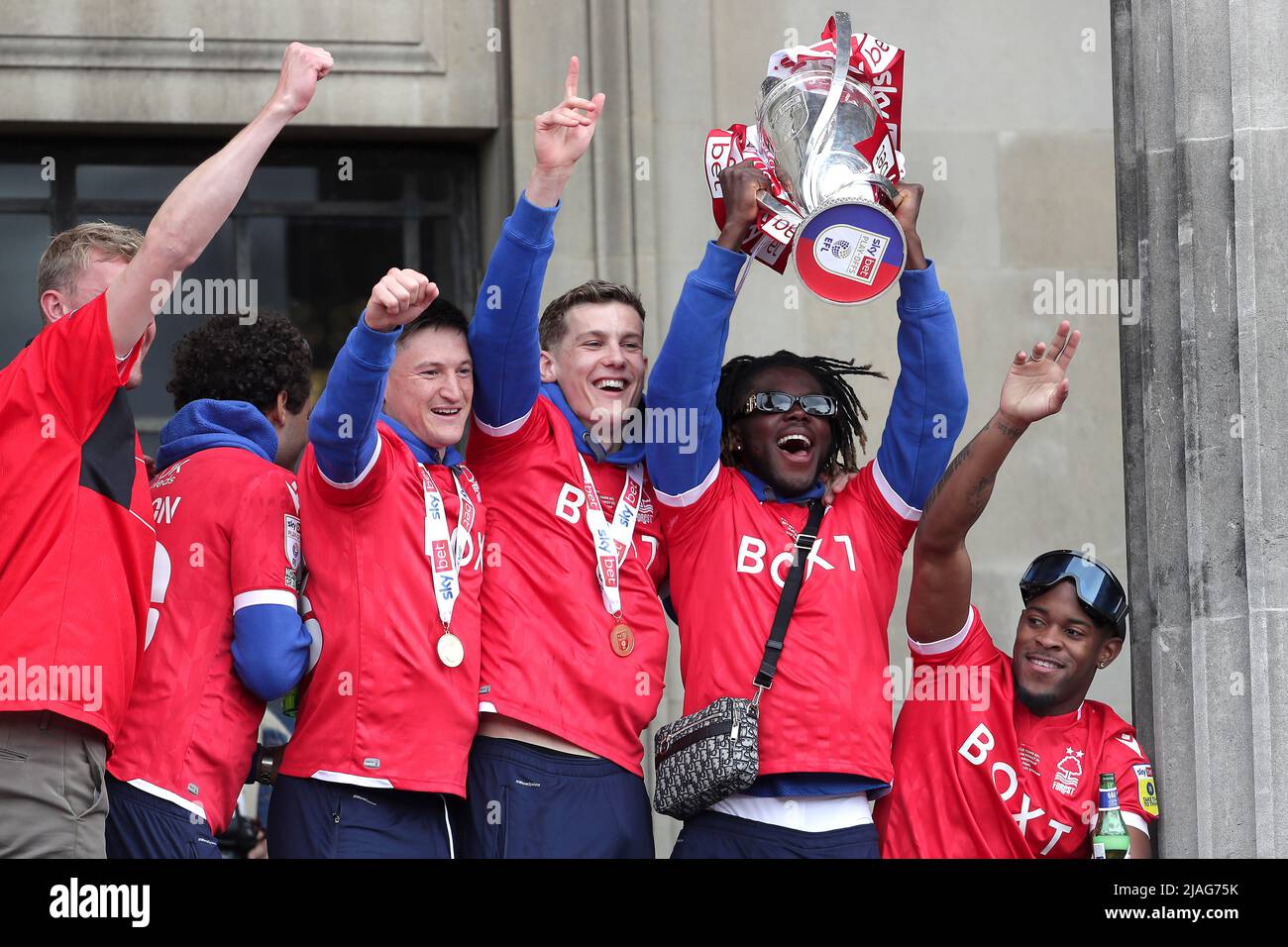 Nottingham Forest's Alex Mighten (second right) lifts the trophy with ...