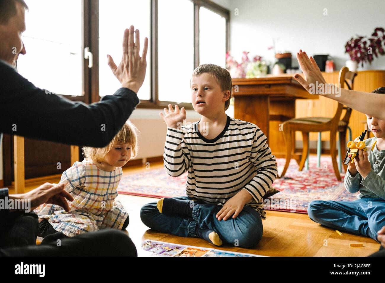 Children high five parents hi-res stock photography and images - Alamy