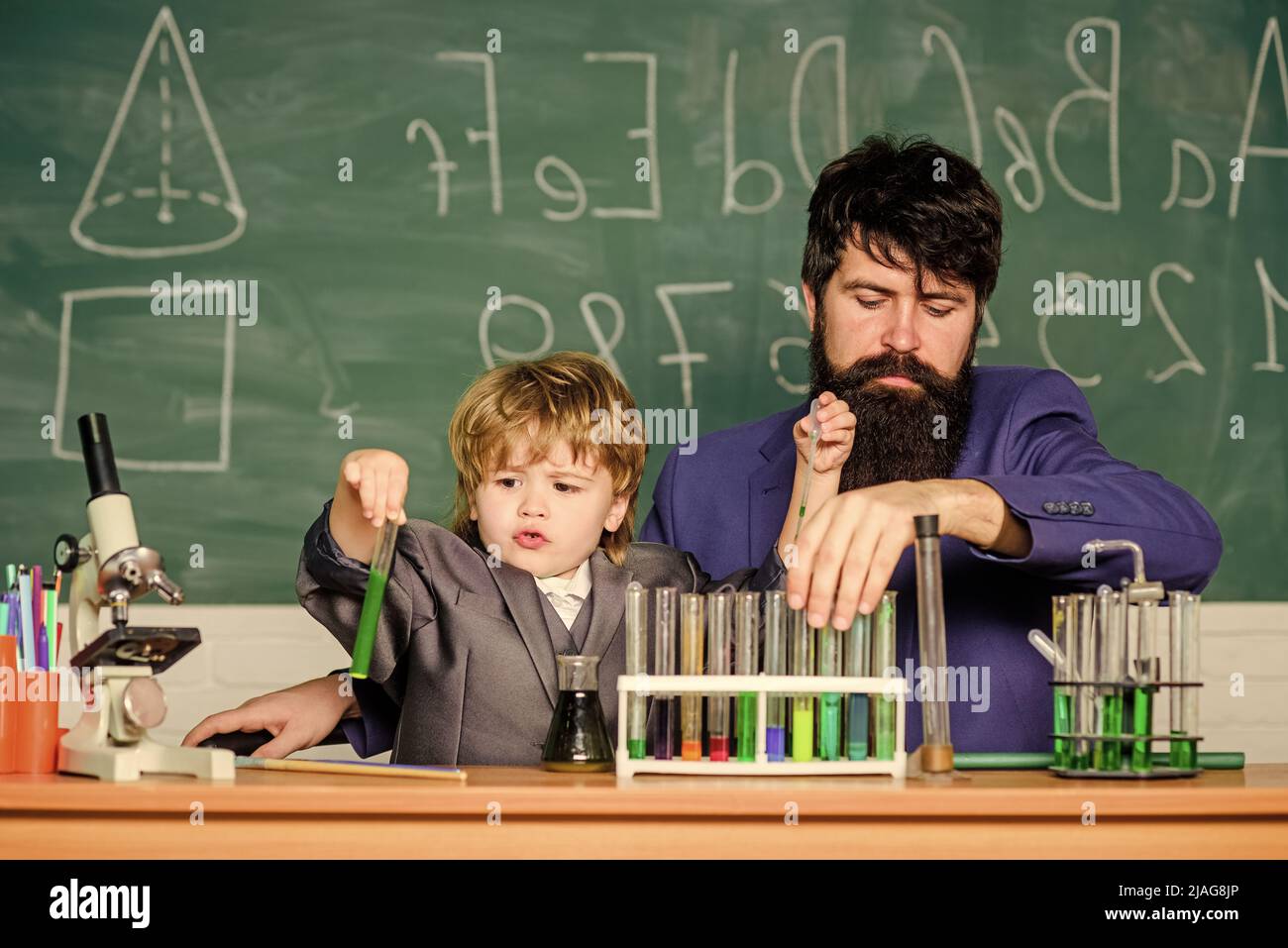 our challenge is our progress. Back to school. Laboratory test tubes ...