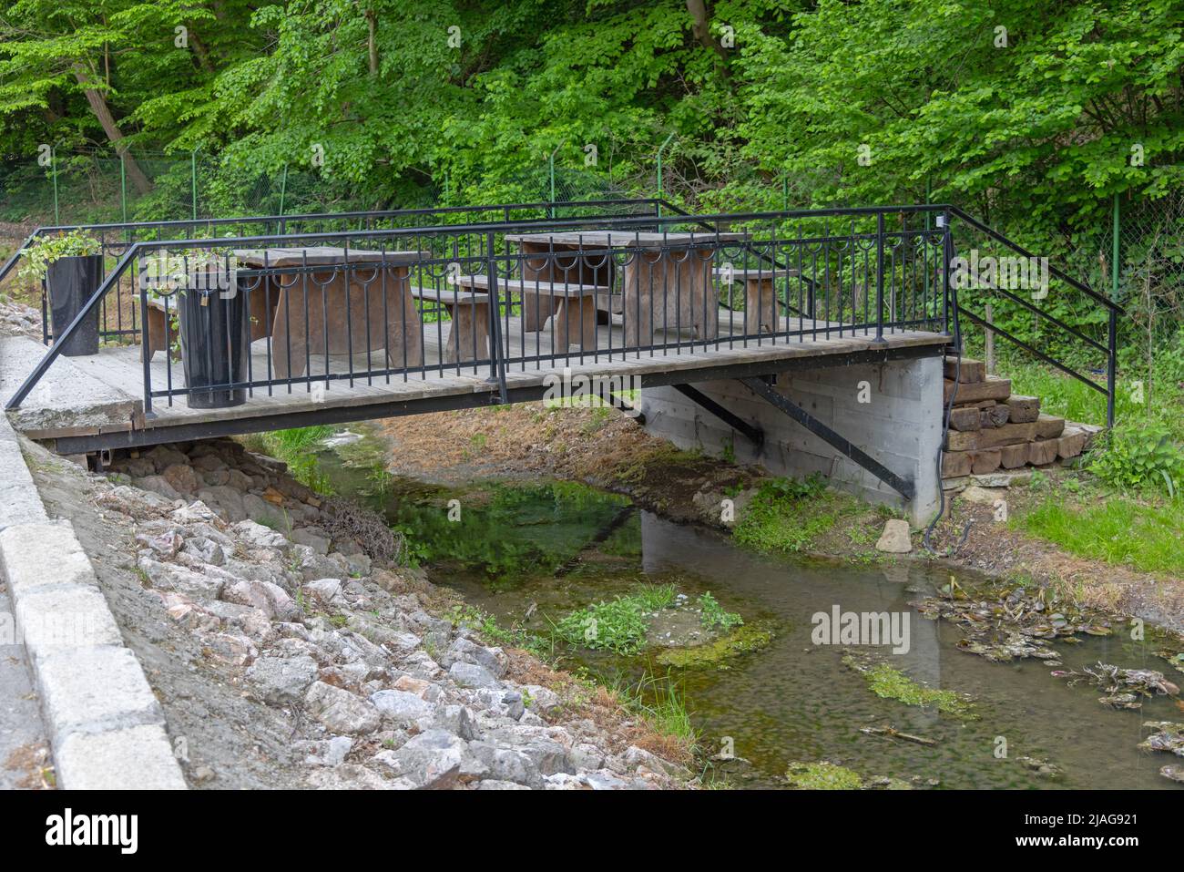 Picnic Tables at Terrace Decking Over River Stream Stock Photo - Alamy