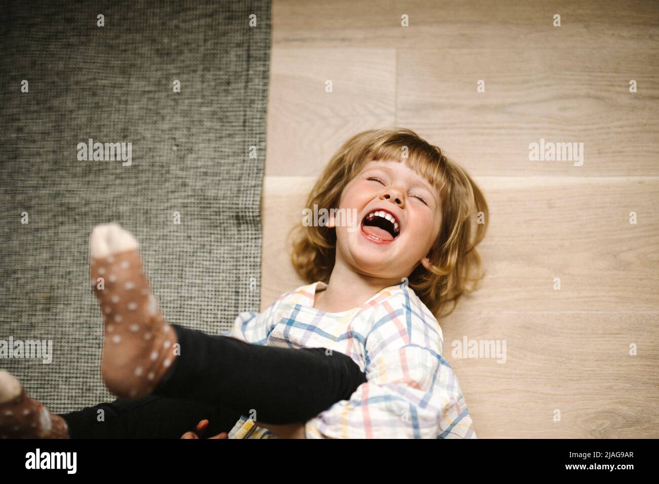 Girl lying down with mouth open hi-res stock photography and images - Alamy