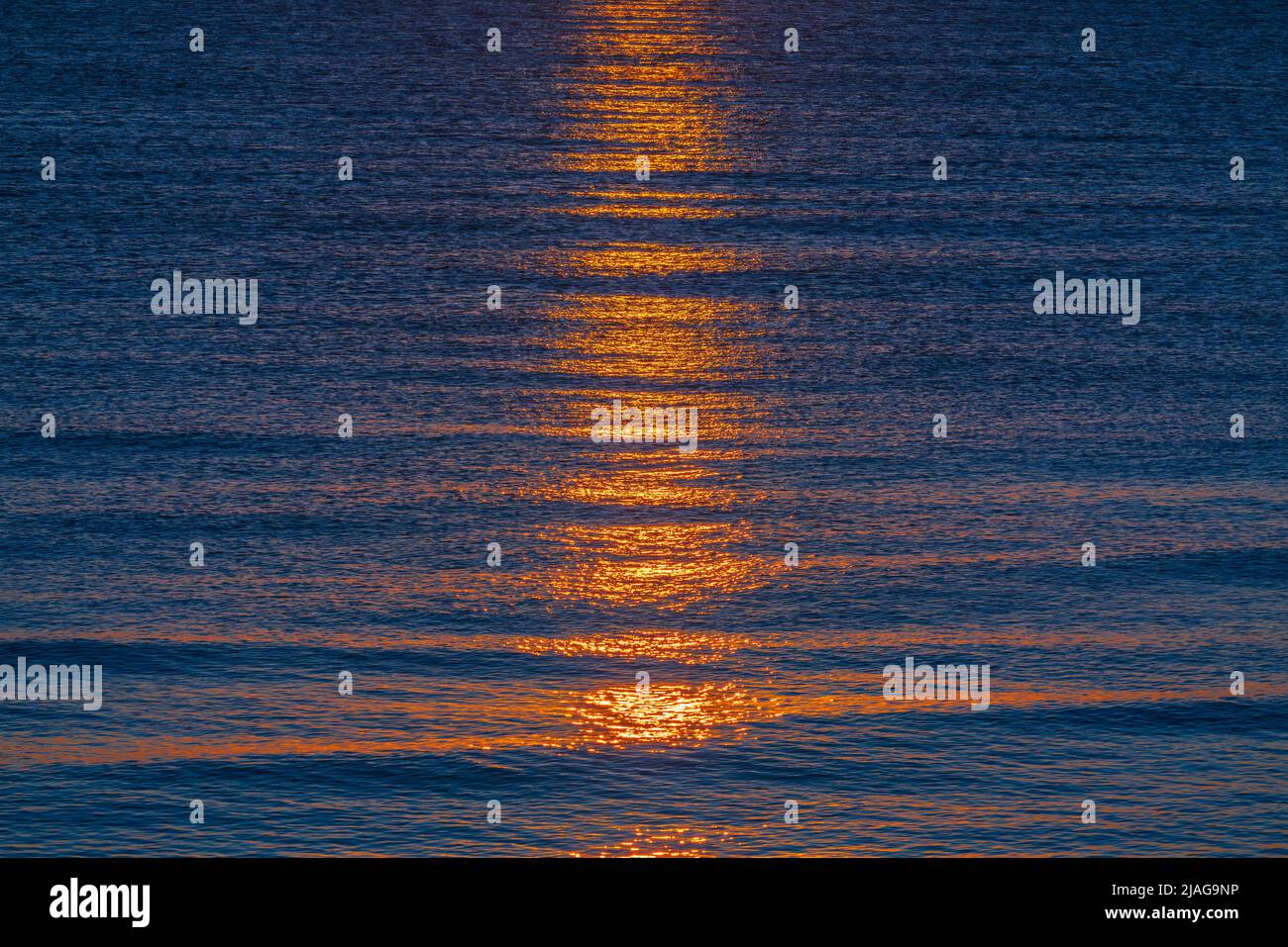 Golden sun rising over ocean hi-res stock photography and images - Alamy