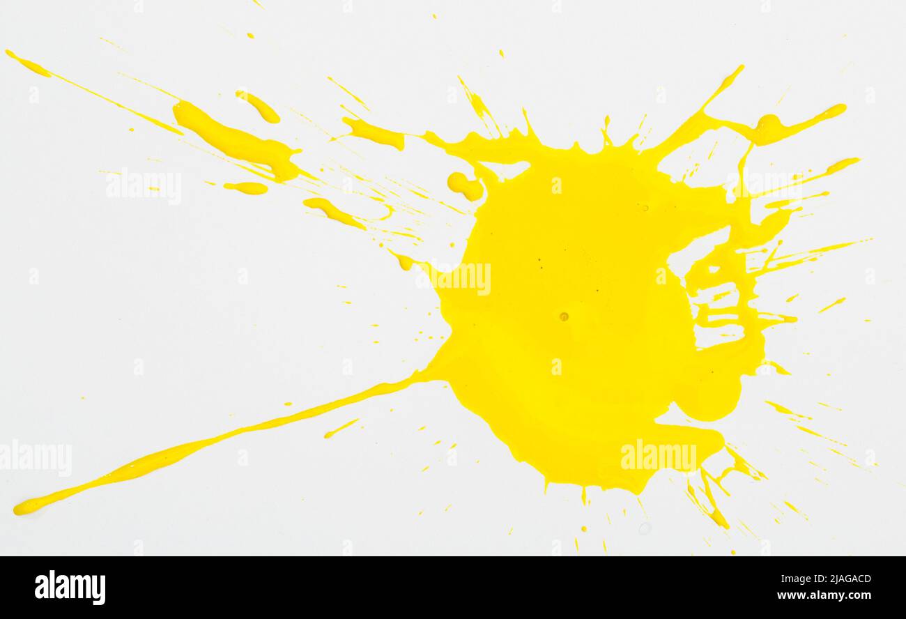 Yellow paint spots on paper, colorfull artistic image on white ...