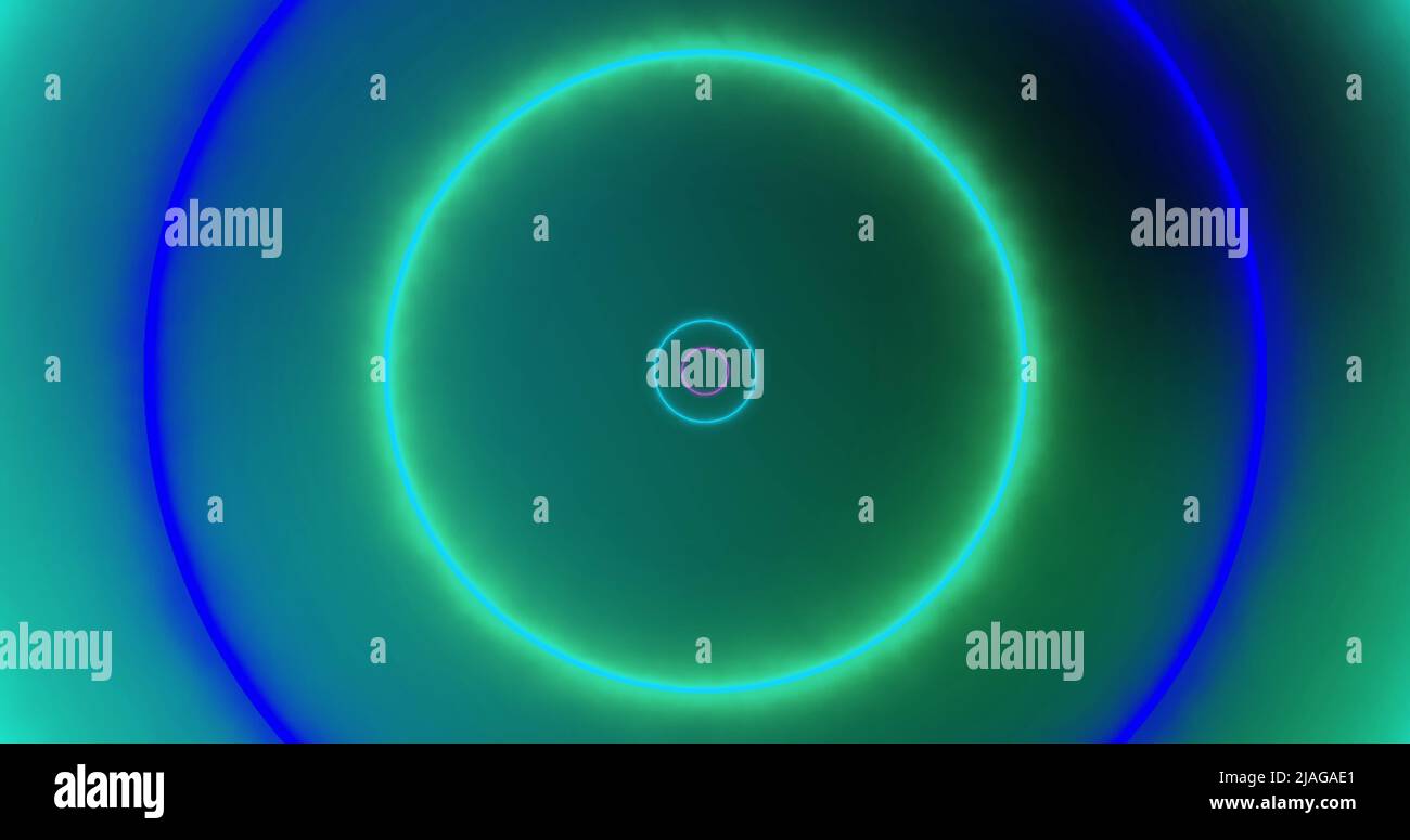Image of yellow, blue, pink and green pulsating neon circles on green ...