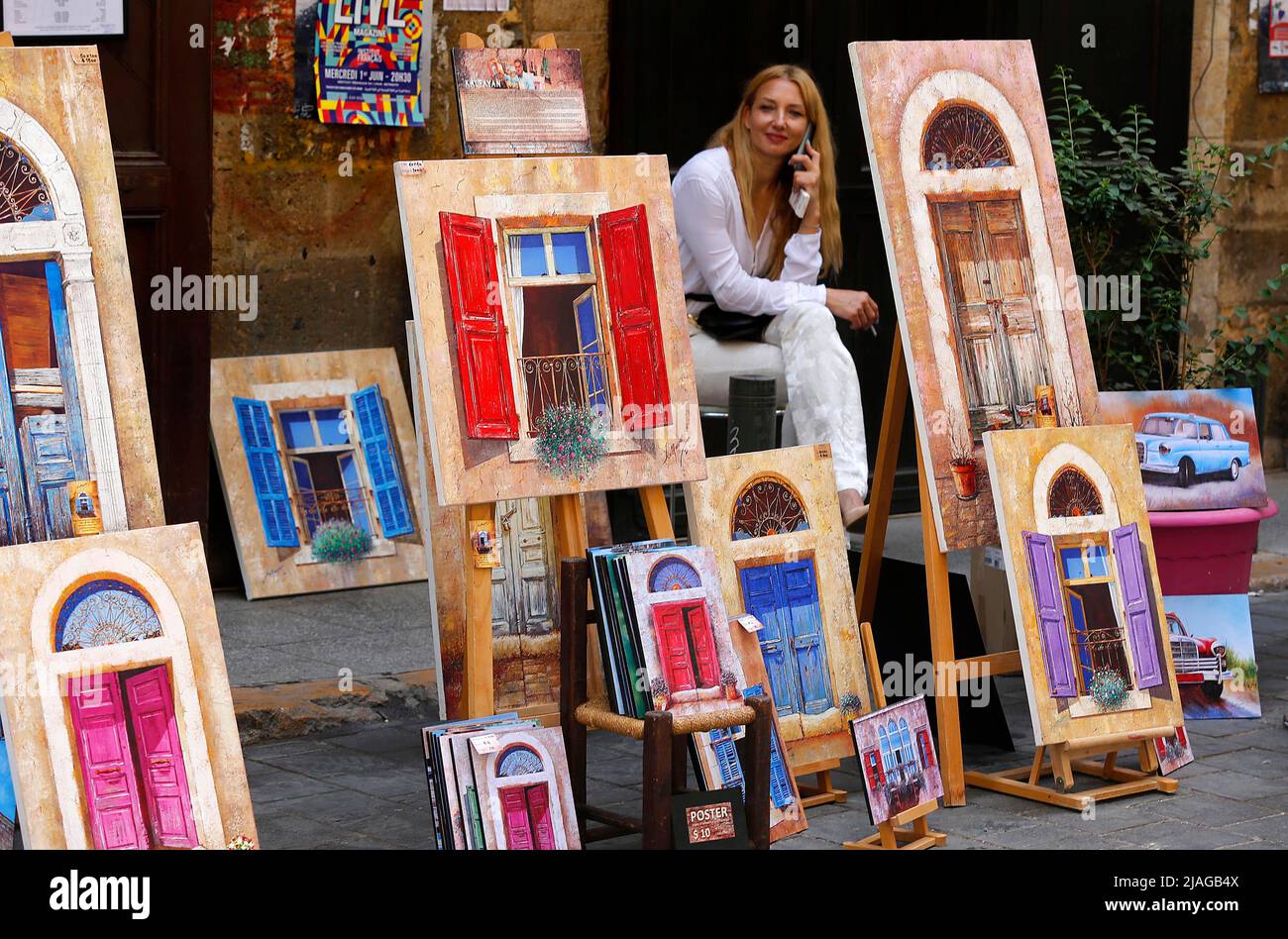 Beirut, Lebanon. 29th May, 2022. A sales woman sits at an art booth at ...