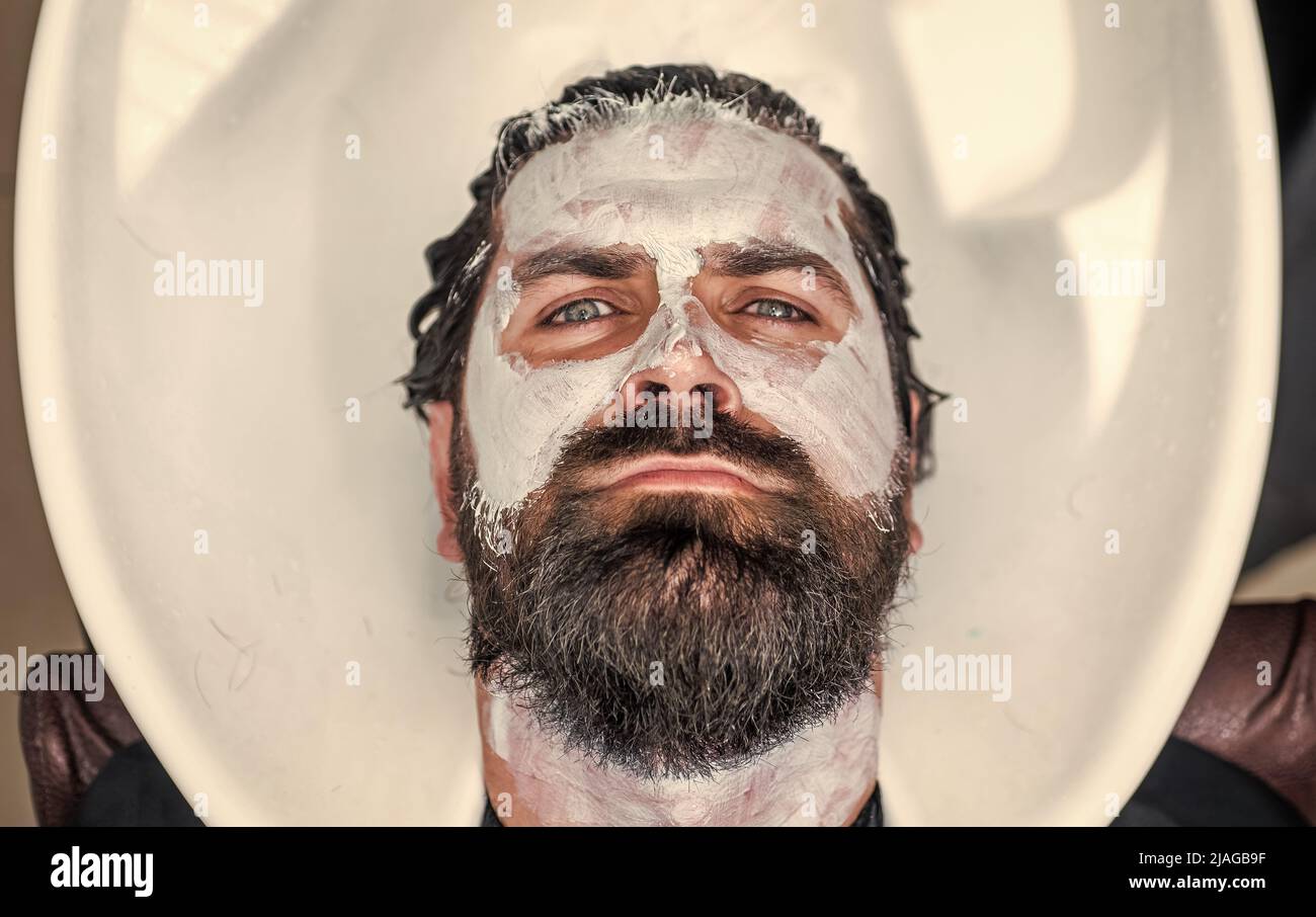 facial mask. caucasian guy with moustache and cream on face. male ...