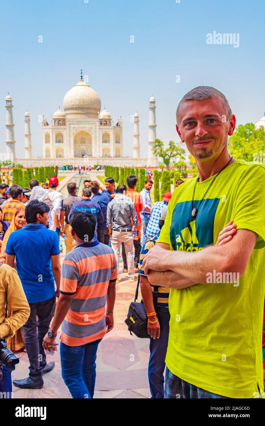 Traveler and tourist poses in front of the famous Taj Mahal in Agra ...