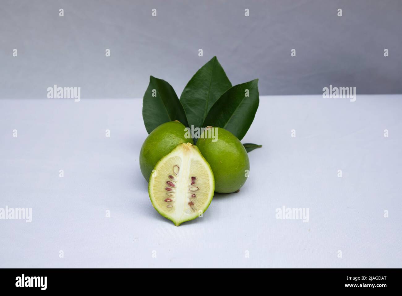 Fresh green lemon slice pieces with leaf. testy lemon fruits ...