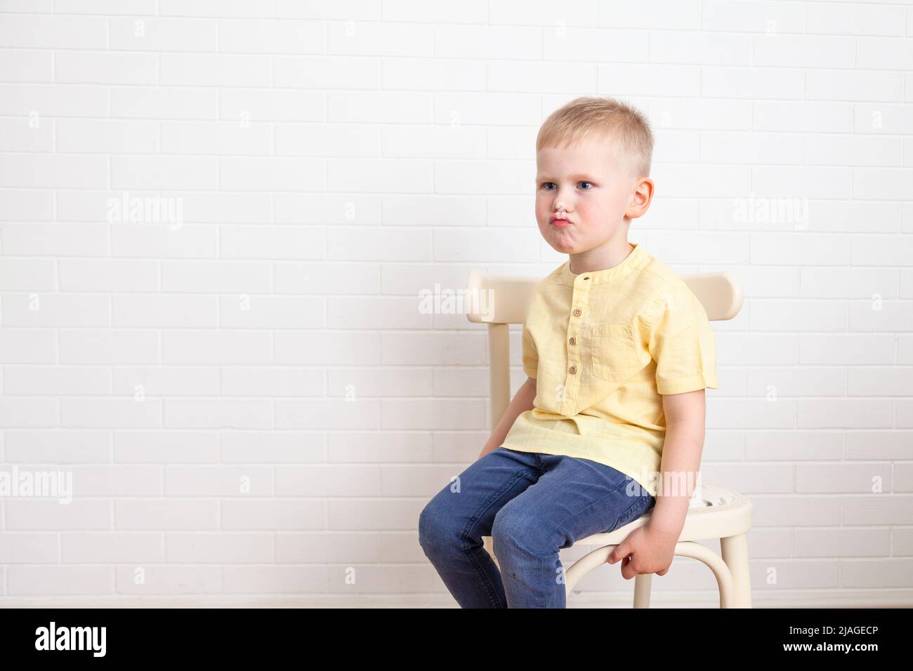 European blond boy gets angry Stock Photo - Alamy