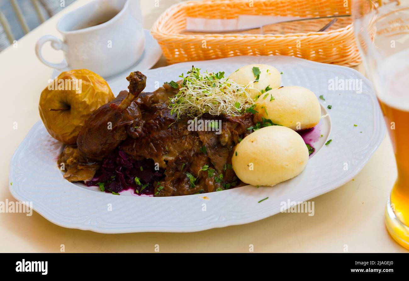 Baked duck with blue cabbage and yeast dumplings Stock Photo - Alamy