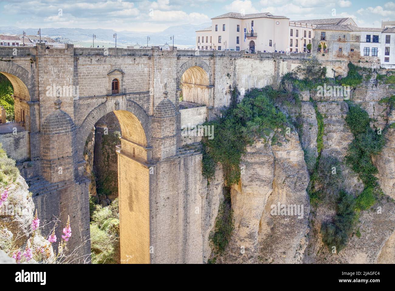 Ronda, Malaga, Spain - People walking across New Bridge spanning the ...
