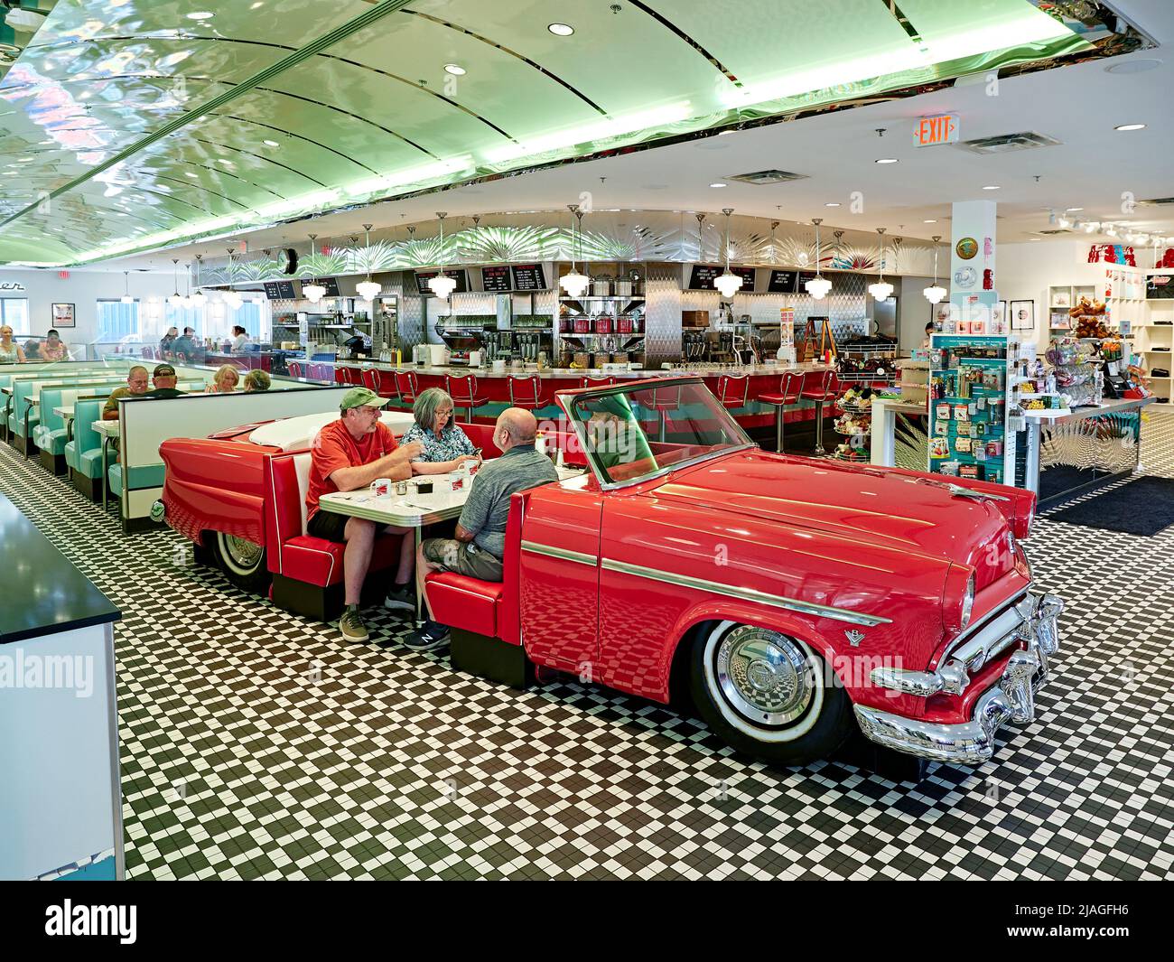 Restaurant with family diners enjoying lunch or dinner while at the ...