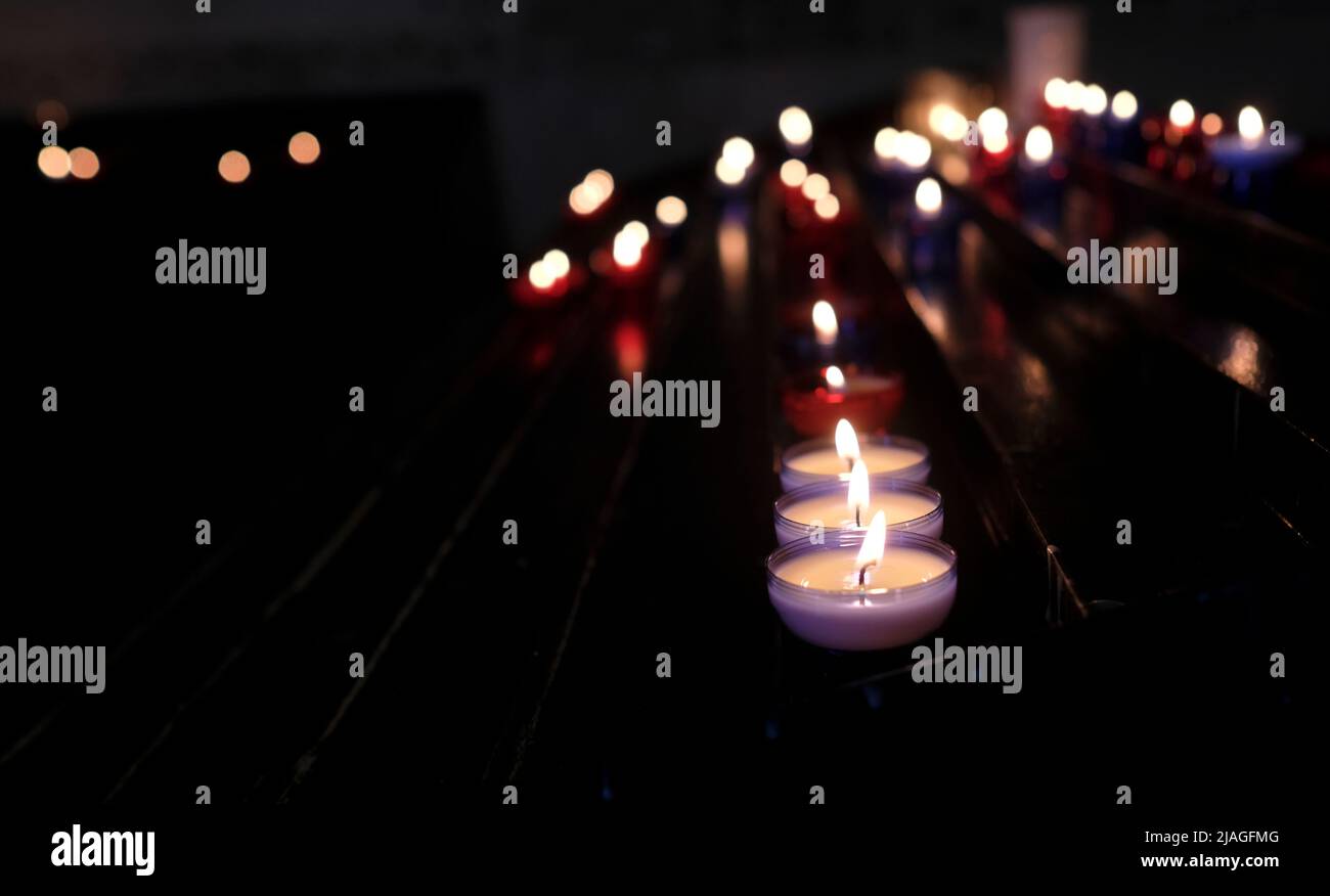 Many candles burn in church hi-res stock photography and images - Alamy