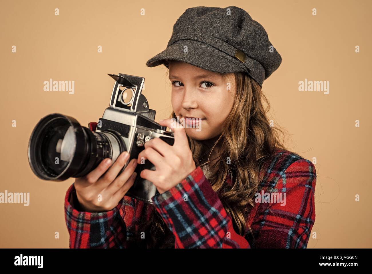parisian child make photo. stylish kid in french beret use retro camera ...
