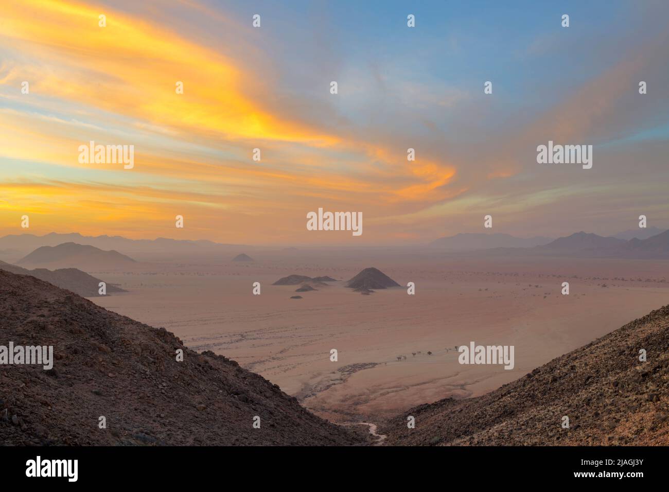 Golden wind swept clouds at sunset Namibia Stock Photo - Alamy