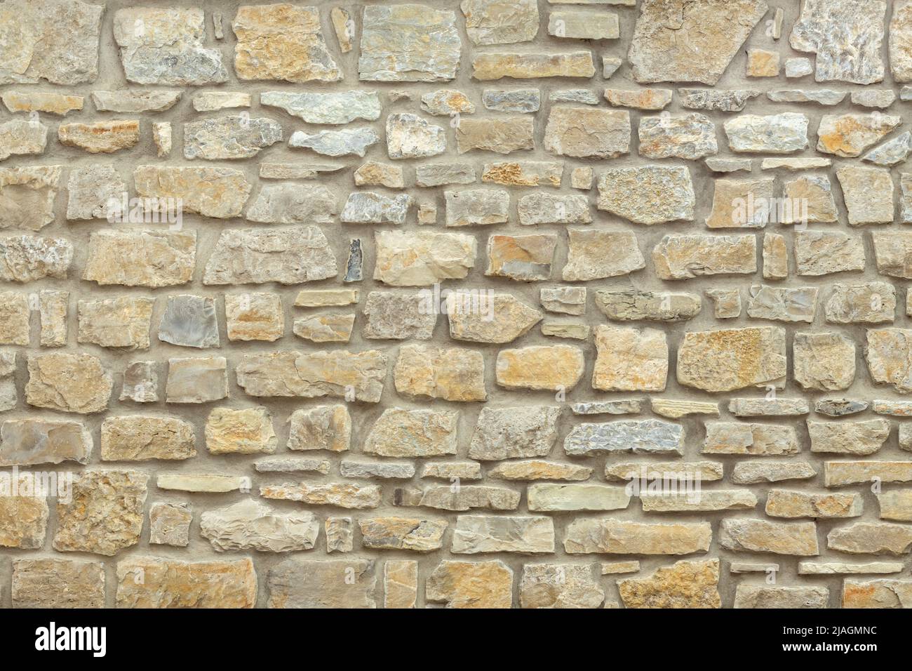 Solid yellow and beige stone wall. Stone background Stock Photo - Alamy