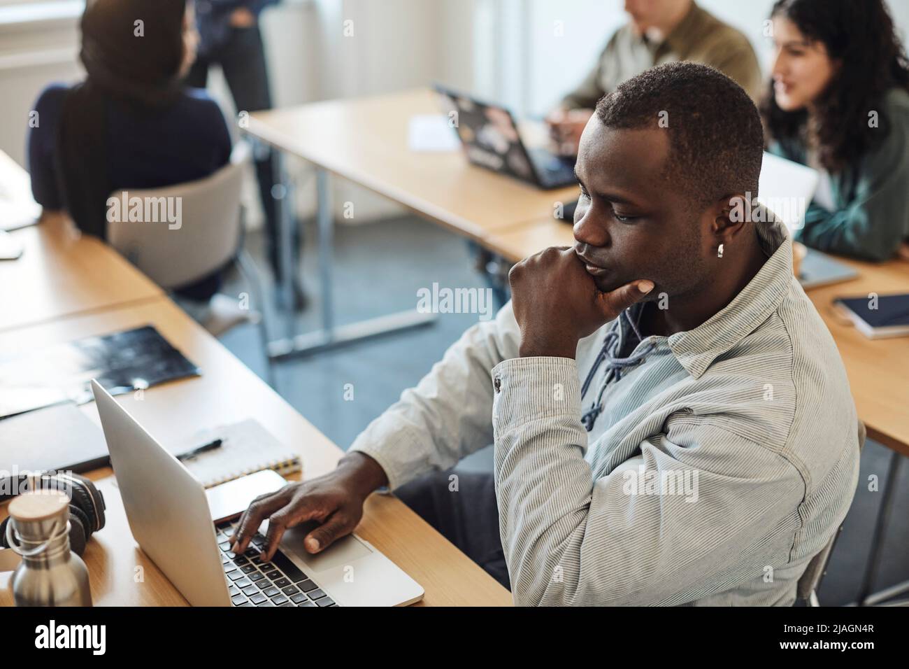 Students using laptop in class hi-res stock photography and images - Alamy