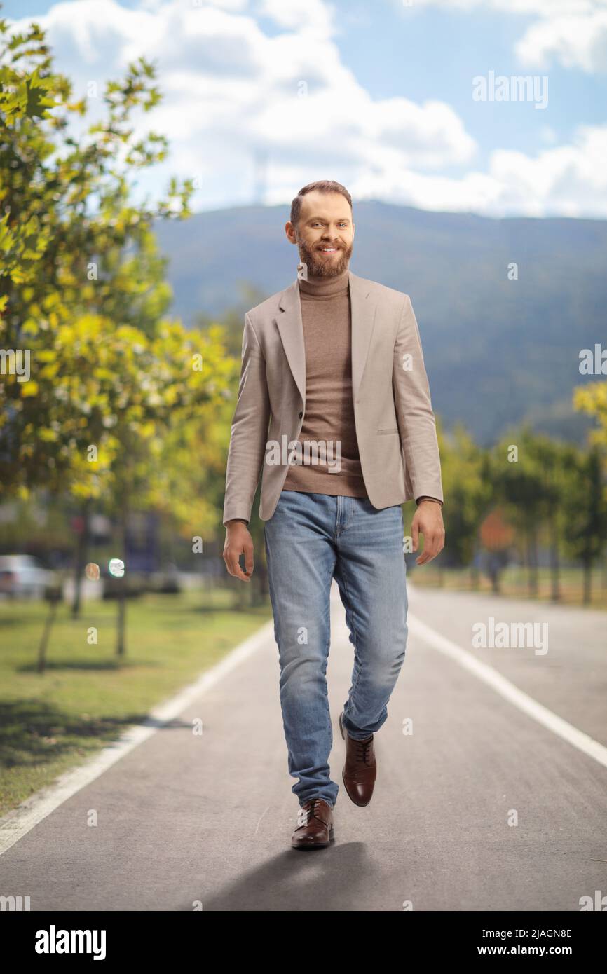 Single man walking on pedestrian hi-res stock photography and images ...