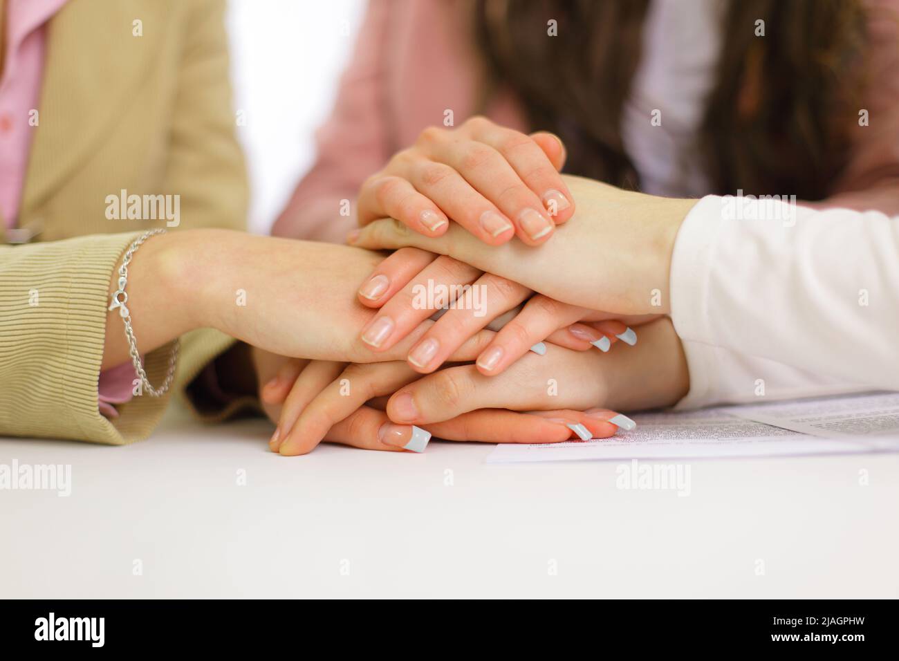 Image of business people hands on top of each other Stock Photo - Alamy