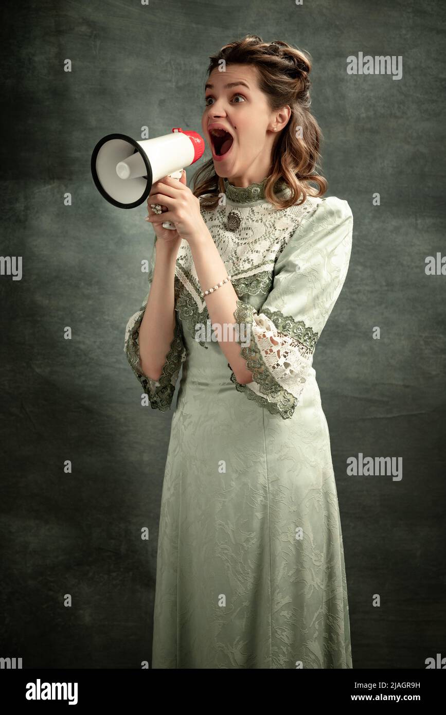 Vintage portrait of young shouting girl in medieval style dress with ...