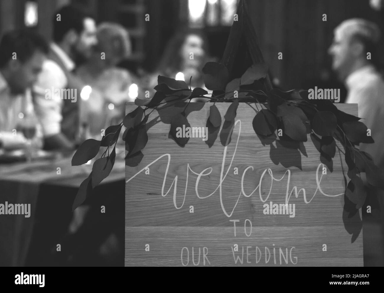 Wedding feast. Guests sit at festively decorated table. Evening ...