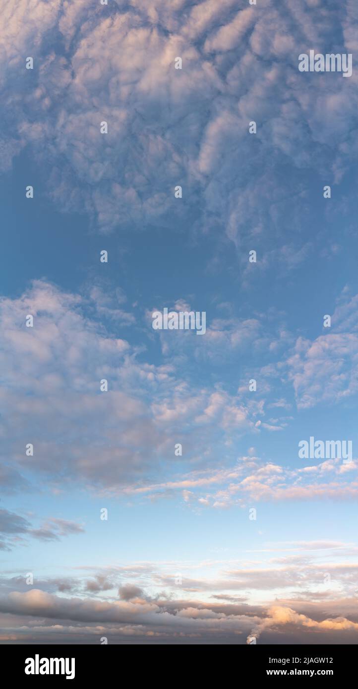 Fantastic clouds at sunrise, vertical panorama Stock Photo - Alamy