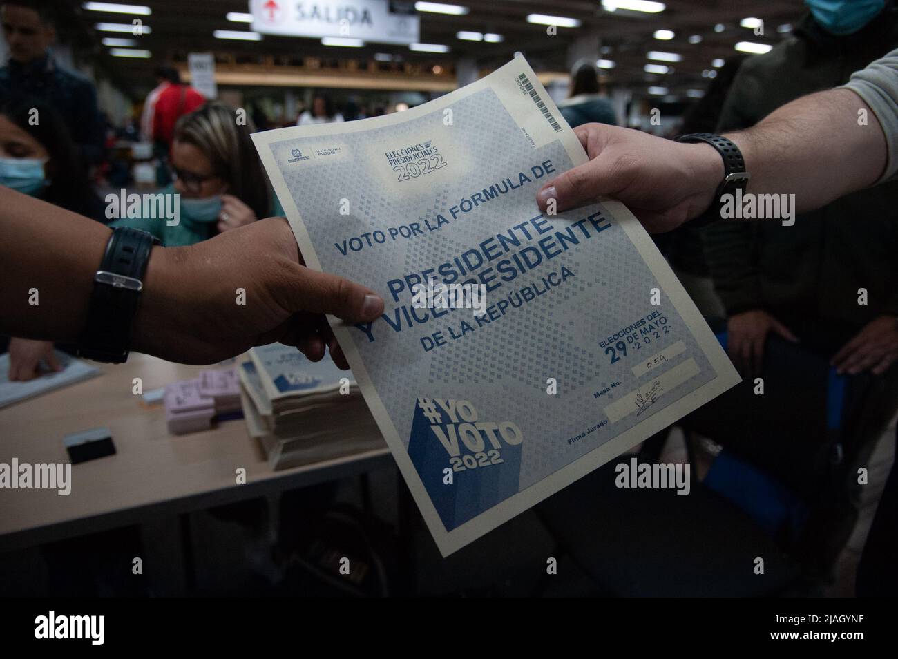 Electoral jury hands the presidential election ballots to voters during ...