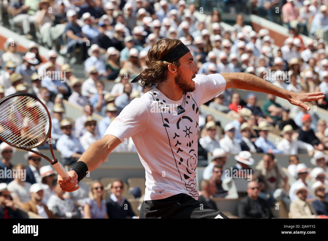 Paris, France. 30th May, 2022. Stefanos Tsitsipas of Greece returns the ball to Holger Rune of ...